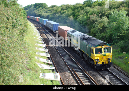 Heavy goods train passing through Lewisham Station Stock Photo - Alamy