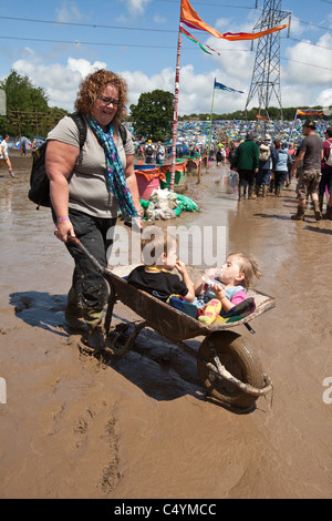 Wheelbarrow with Water in a Muddy Field Stock Photo - Alamy