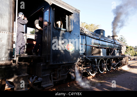Steam locomotive with the smoke blowing off out of the smokestack Stock ...