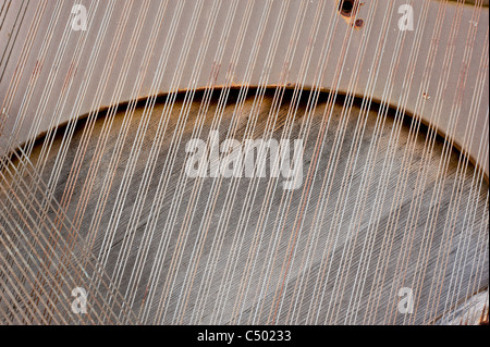 The mechanism inside an old piano. Corroded cords can be seen Stock ...
