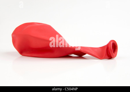 A deflated happy birthday balloon on the floor Stock Photo - Alamy