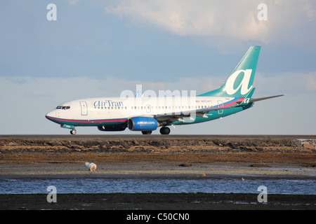 A Boeing 737 of Air Tran airlines on final approach Stock Photo - Alamy