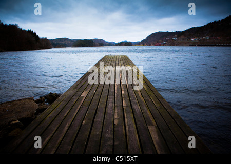 Wooden pier looking out onto lake and mountains Stock Photo - Alamy
