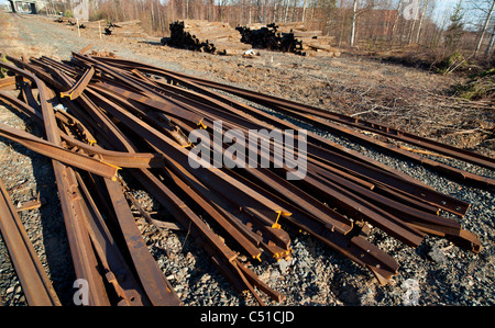 Pile of scrap rail railway railroad track rusty grungy metal plates ...
