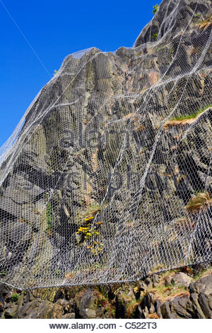 Safety net on a rock face Stock Photo - Alamy