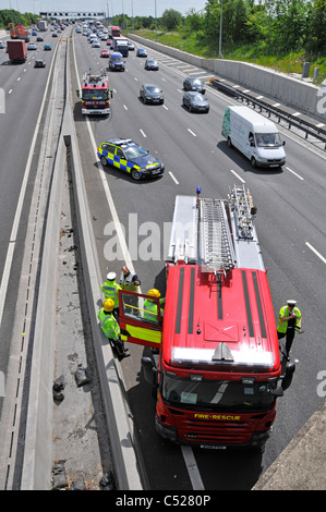 Fire engine arriving at the scene of a car fire Stock Photo - Alamy