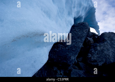 Fantastic blue wavy ice shapes (glacier) in Sayan mountains. Wild ...