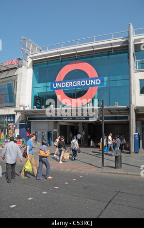 Pedestrians and passengers outside Brixton Underground station, London ...