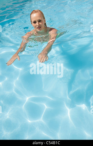 An image of a beautiful woman swimming in the pool Stock Photo - Alamy