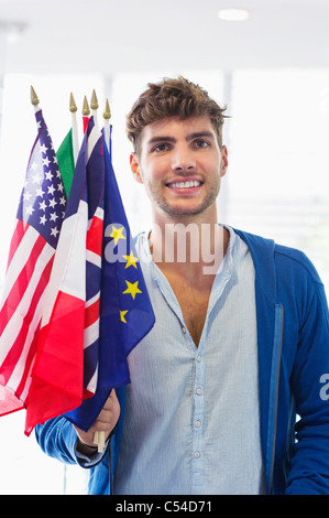 Portrait of man holding European flags, symbol both the European Union ...