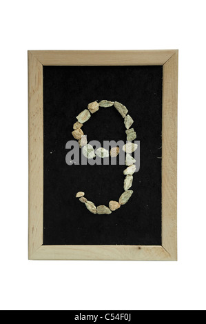 Number nine stone made on black background in frame Stock Photo - Alamy
