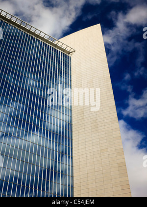 contemporary building with sharp angles, glass windows, and light ...