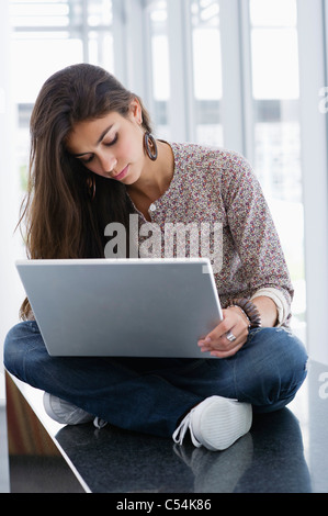 Beautiful Young Woman Using Her Laptop Smiling at Camera Stock Photo ...