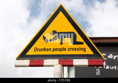 warning sign "Drunken people crossing" on blue with clipping path Stock ...