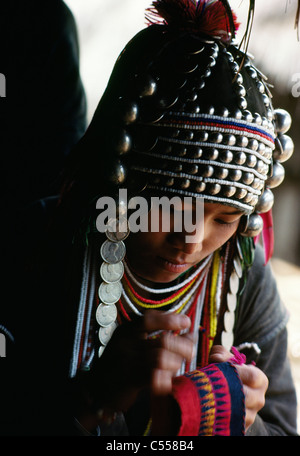 Akha girl with traditional clothing and headdress, portrait, Chiang Rai ...