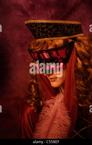 Beautiful medieval woman holding a feather Stock Photo - Alamy