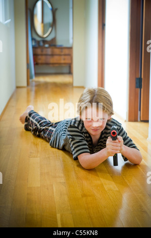 Child pointing toy gun to camera one little boy Stock Photo - Alamy