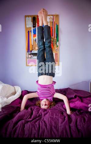 Tween Girl Doing Headstand Stock Photo - Alamy