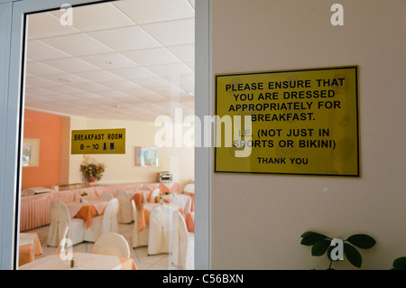 Sign in a hotel restaurant warning guests not to remove food from the ...