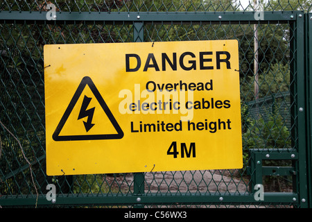 overhead power cable warning sign for trains with electricity lines in ...