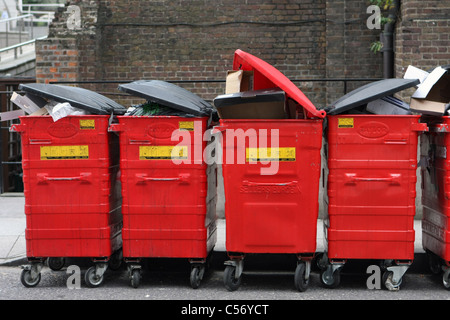 Orange commercial wheelie bins Stock Photo - Alamy