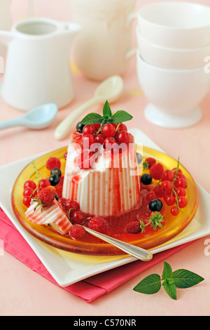 A vertical closeup of a chef pouring sauce on a burrito stack Stock ...