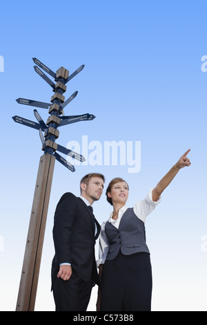 Young man standing at crossroads. Concept of choice Stock Photo - Alamy