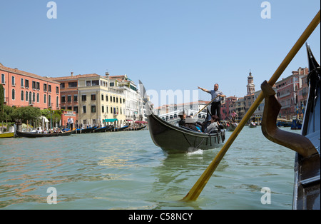 Gondola boatman rowing down canal, Venice, Italy Stock Photo - Alamy
