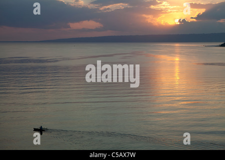 Sunset with a yacht over Port Vila harbour in Vanuatu Stock Photo - Alamy
