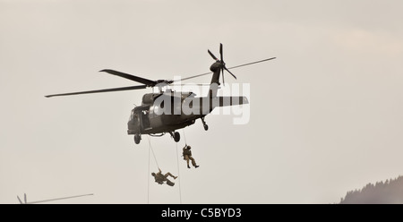 Rappelling from a helicopter Stock Photo - Alamy