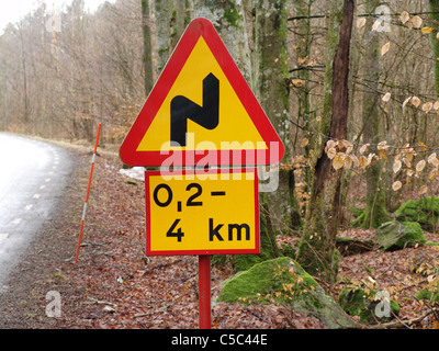 Dangerous bend warning sign in road with arrow signs in rolling Stock ...