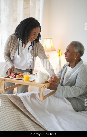 Breakfast In Bed : teapot, two cup of tea, croissants and meringue on ...