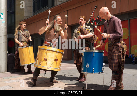 music band with traditional Scottish kilts performing in Glasgow city ...