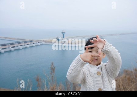 girl making rectangular shape using her fingers Stock Photo - Alamy