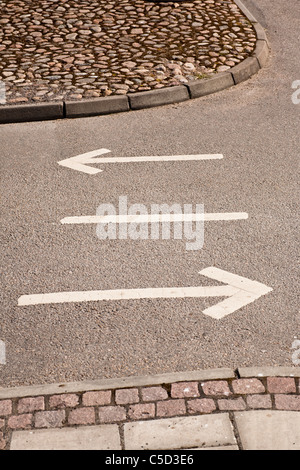Road sign with two arrows pointing down to opposite sides Stock Photo ...