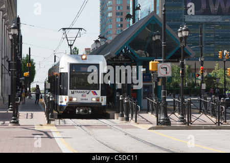 A New Jersey Transit Hudson–Bergen Light Rail (HBLR) train departs from ...