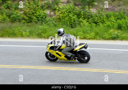 A yellow Kawasaki Ninja ZX6R sport bike motorcycle on a in the White ...
