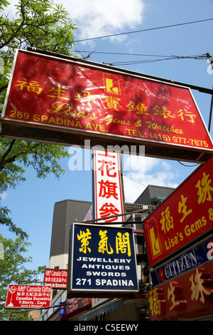 bilingual english and chinese shop signs in chinatown toronto ontario ...