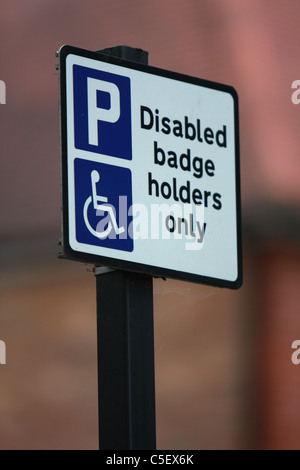 Blue badge sign. Disabled parking space sign Stock Photo - Alamy