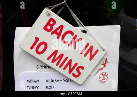 BACK IN TEN MINUTES sign on the door of a temporarily closed shop Stock ...