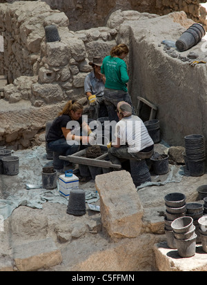 Archaeological excavations, archaeologists work, dig up an ancient clay ...