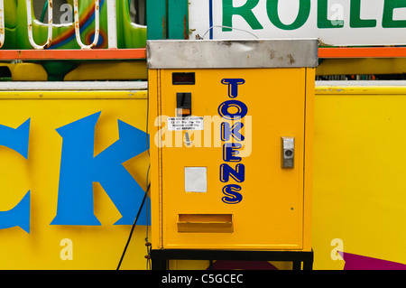 Token machines at a funfair Stock Photo - Alamy