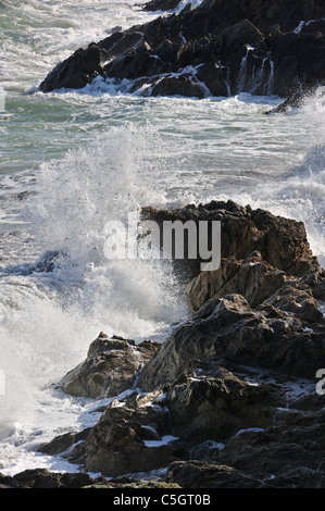 waves splashing onto rocks at sea Stock Photo - Alamy