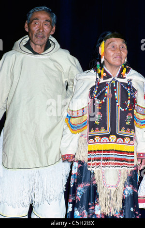 Inuit woman, wearing traditional clothes, with a papoose on her back in ...
