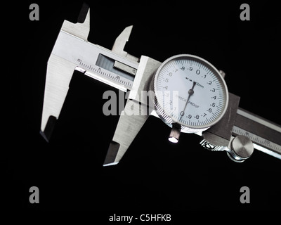 Dial caliper and engineering measurement equipment, sitting on ...