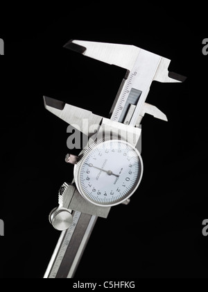 Dial caliper and engineering measurement equipment, sitting on ...