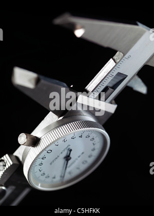 Dial caliper and engineering measurement equipment, sitting on ...