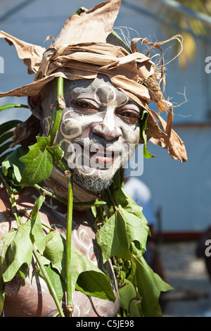 Man dressed in native tribal costume performs for cruise ship tourists ...