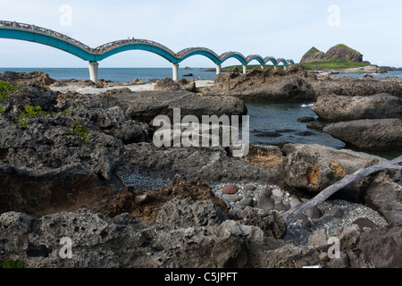 The iconic eight-arch footbridge and a small island off the coast at ...