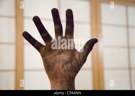 Blackened male hand Stock Photo - Alamy